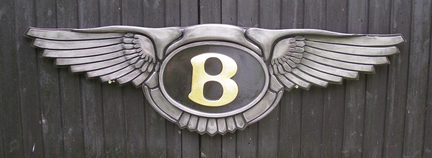 Bonhams Cars : A cold cast aluminium winged Bentley badge,