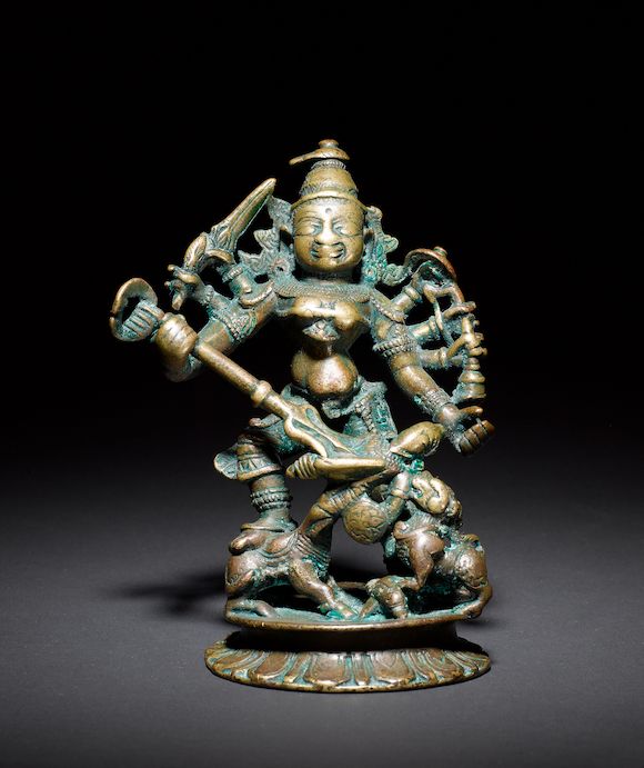 Bonhams : A Deccan bronze figure of Durga Mahisasuramardini slaying the ...
