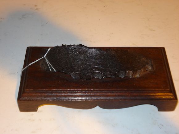 Bonhams : A rare mounted piece of WWI Zeppelin bomb shrapnel, 1916,