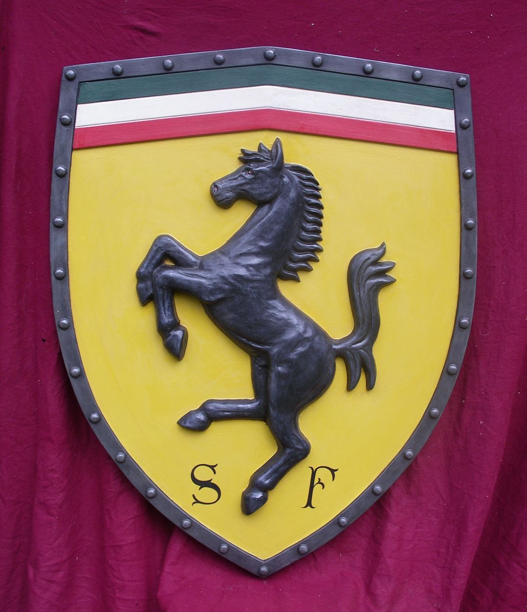 Bonhams Cars : A hand painted cast glass fibre Ferrari badge,