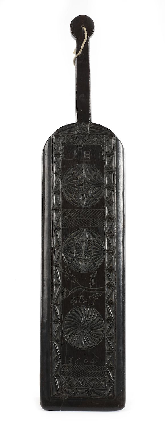 Bonhams : A 17th century Scottish lignum vitae washing bat,