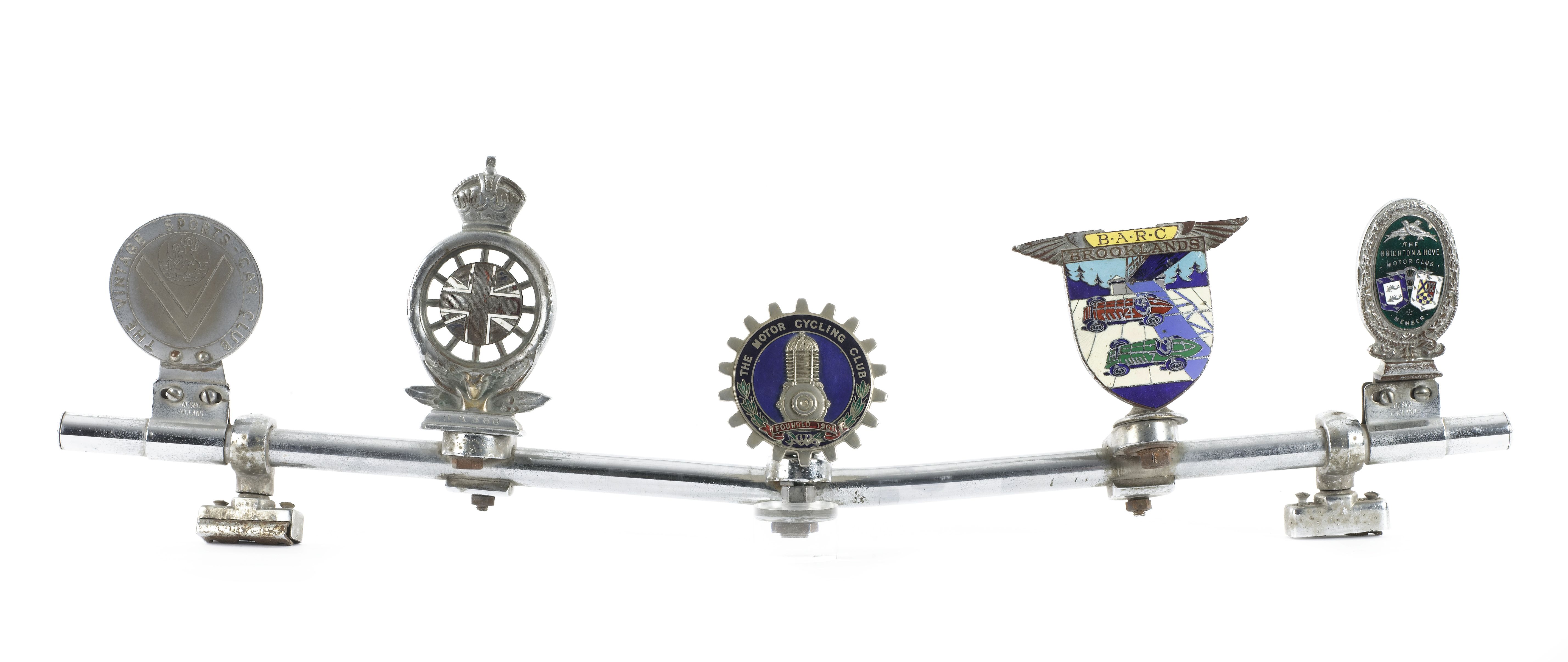 Bonhams Cars : A badge bar with five original badges affixed,