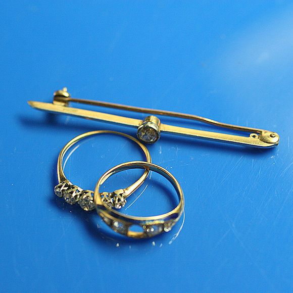 Bonhams : A gold half hoop five stone diamond ring, the graduated claw ...