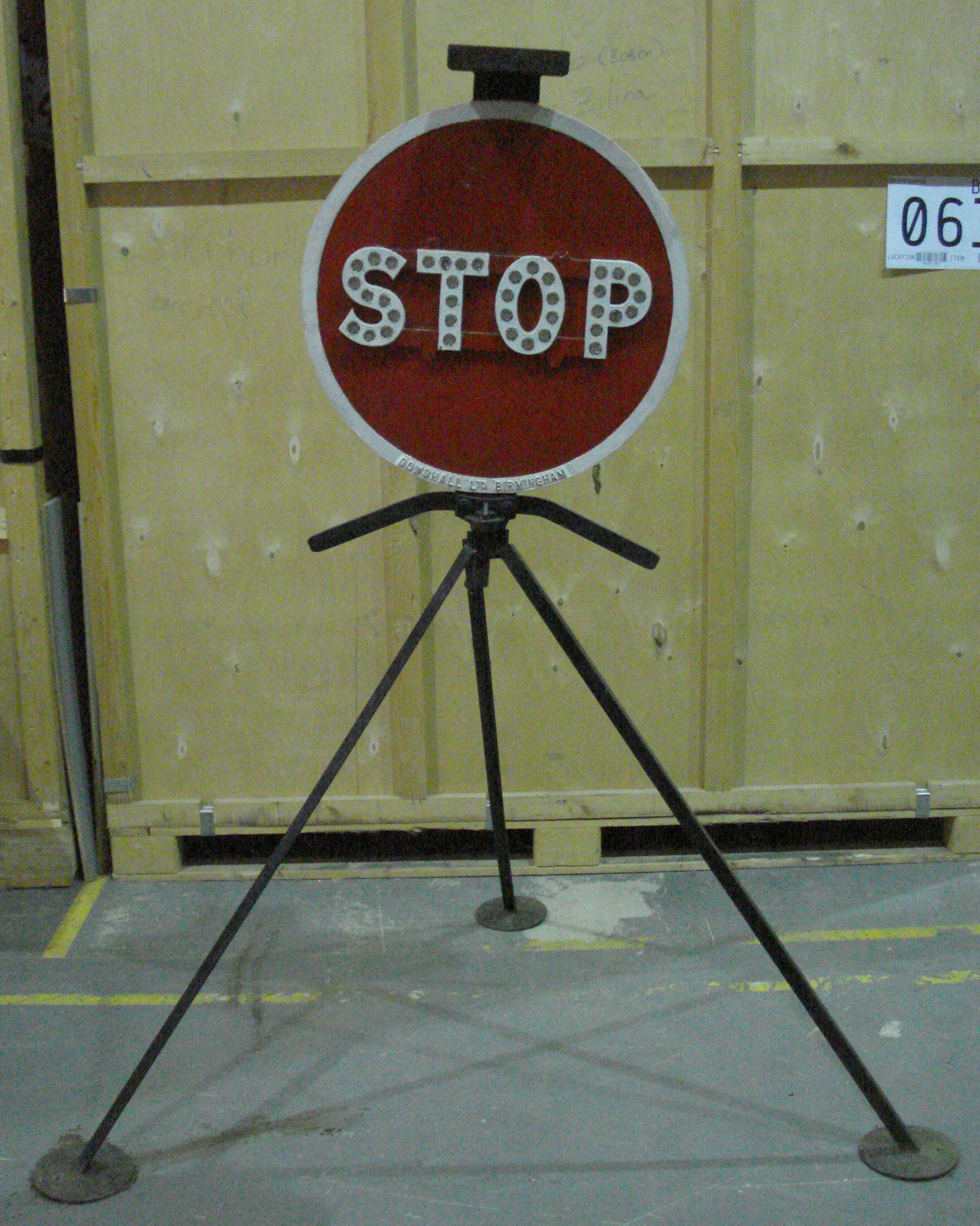Bonhams Cars : A reversible 'Stop/Go' cast alloy temporary road sign,