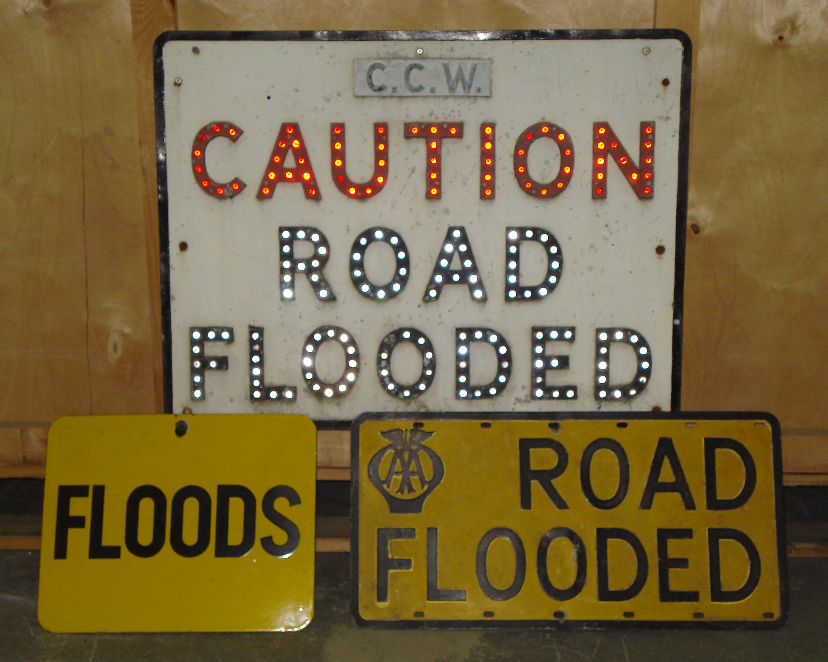 Bonhams Cars : A 'Caution - Road Flooded' alloy standing road sign,