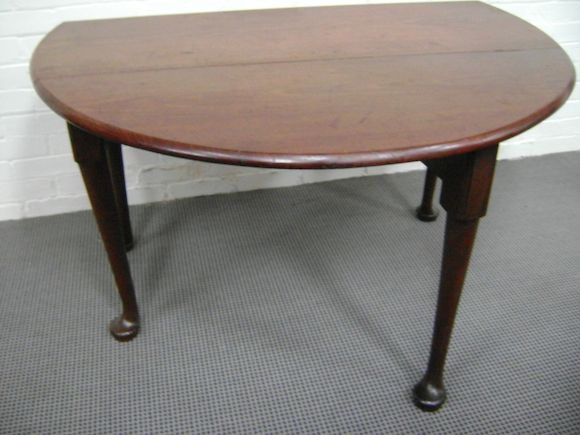 Bonhams : A mid 18th century mahogany drop-flap dining table