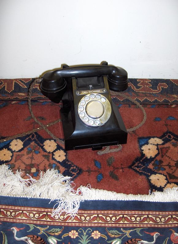 Bonhams : A 1950's black bakerlite telephone.