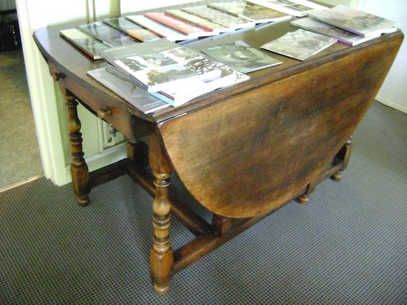 Bonhams : A large reproduction gate-leg table,