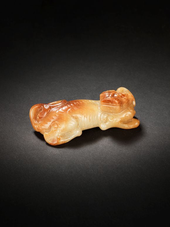 Bonhams : A russet jade carving of a mythical beast, bixie Ming Dynasty
