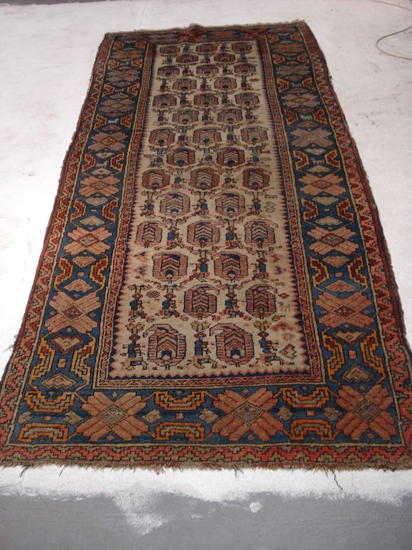 Bonhams : A Kurdish runner West Persia, 9 ft 9 in x 4 ft (296 x 122 cm)