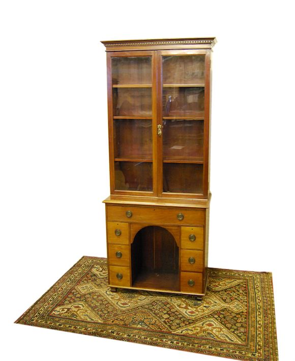 Bonhams : A mahogany bookcase on kneehole desk, early 20th Century