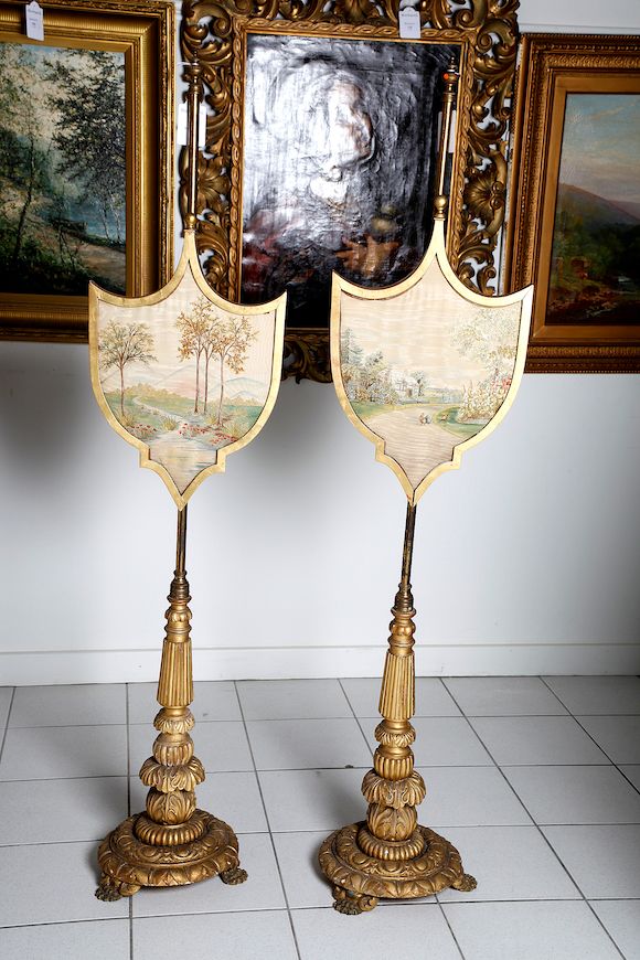 Bonhams : A pair of Victorian carved and gilt wood pole screens