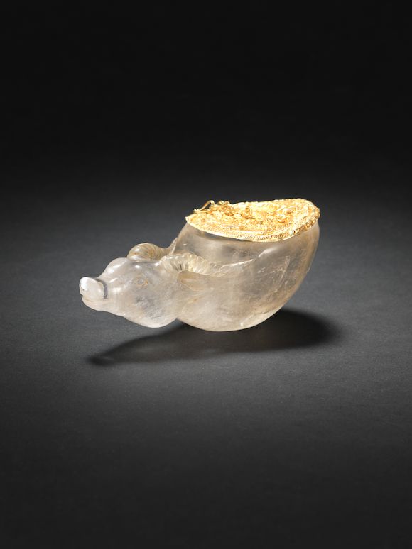 Bonhams : A rare rock crystal 'bovine-head' libation cup and a gold ...