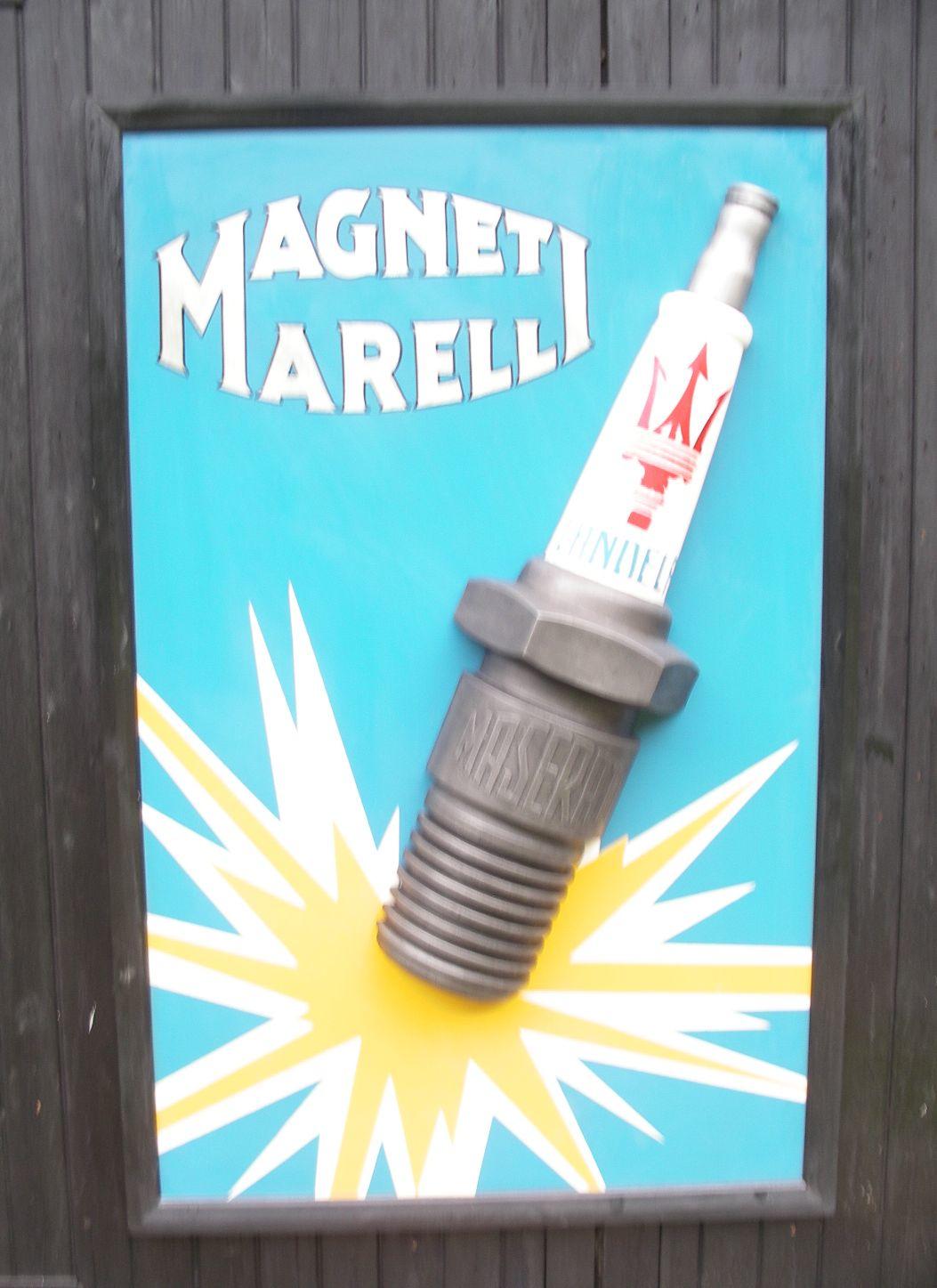 Bonhams Cars : A hand painted spark plug promotional board,