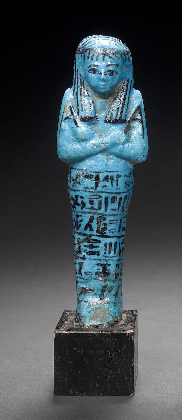 Bonhams : An Egyptian bright blue glazed composition royal shabti
