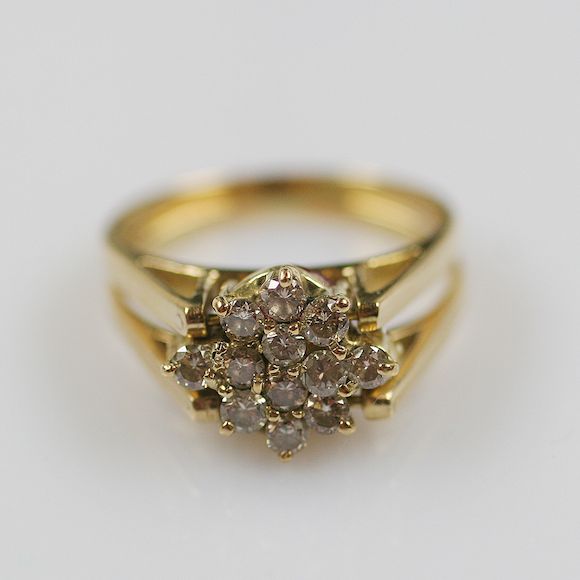 Bonhams : A ruby and diamond swivel ring,