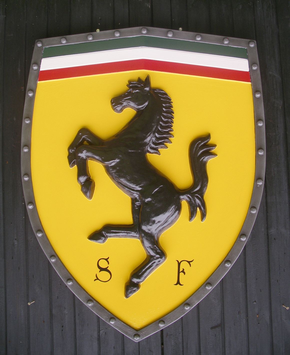 Bonhams Cars : A hand-painted fibreglass Ferrari shield,