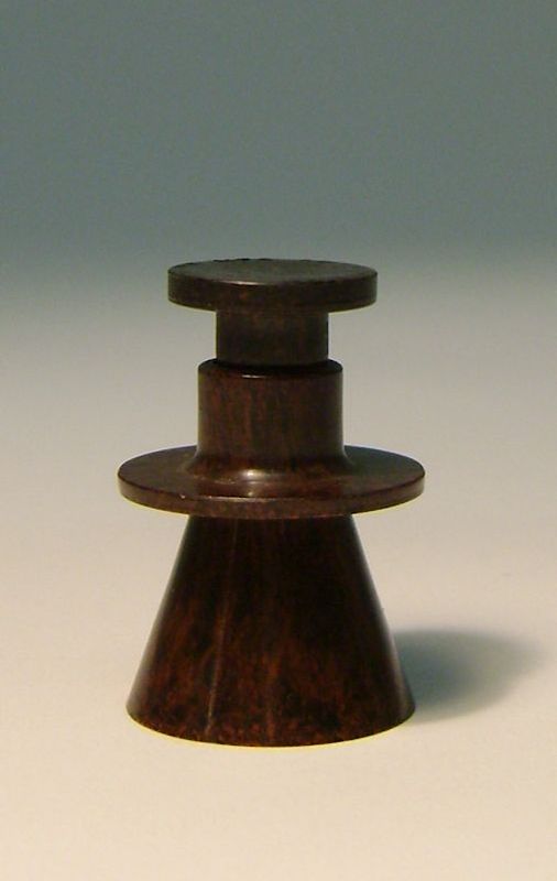 Bonhams : A brown Bakelite plunger sand tee mould circa 1910s