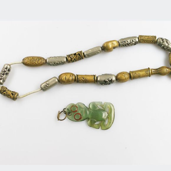 Bonhams : A string of two colour Ju Ju beads,