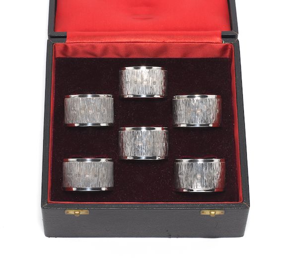 Bonhams : GERALD BENNEY A cased set of six silver napkin rings, London ...