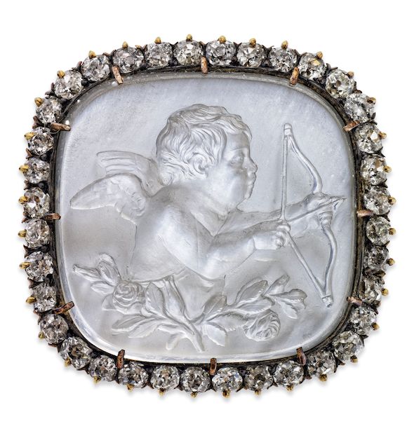 Bonhams : A late Victorian rock crystal and diamond Cupid brooch