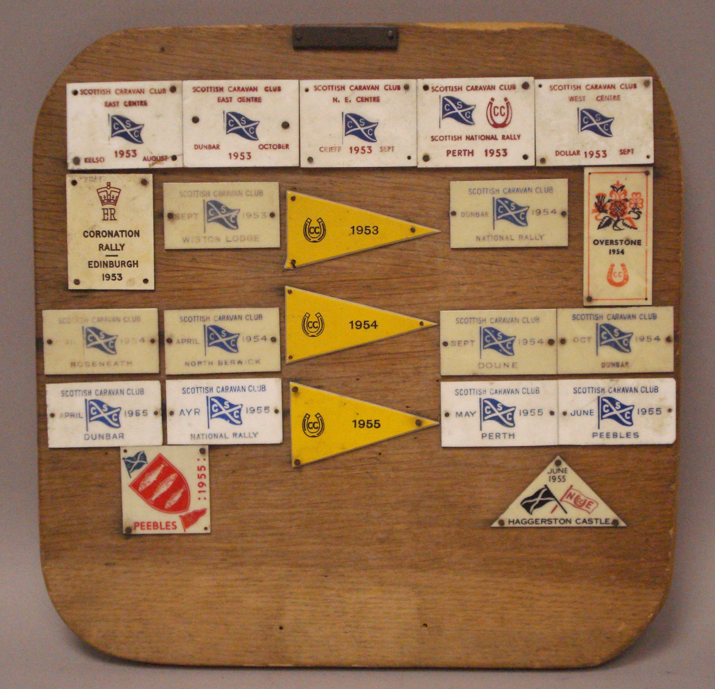 Bonhams Cars : A display board of 23 Caravan Club rally plaques,