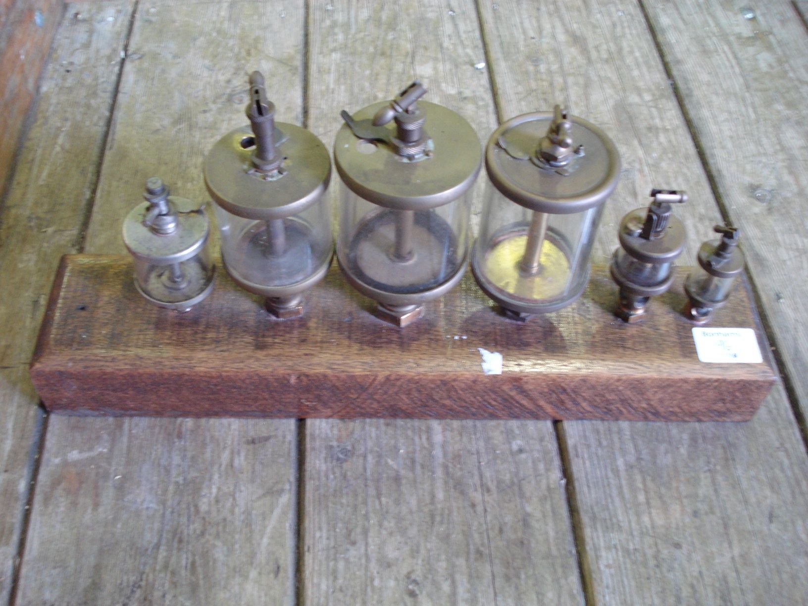 Bonhams Cars : Eight brass oilers suitable for stationary engines.