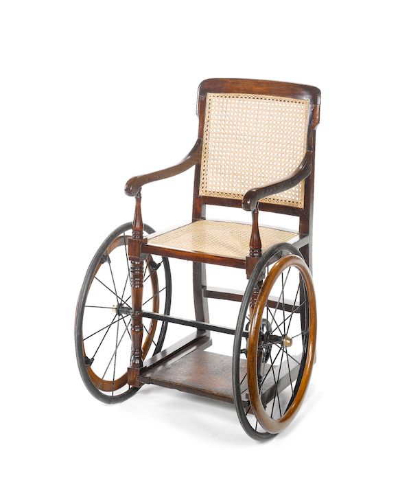 Bonhams : An early 20th century wooden wheelchair,