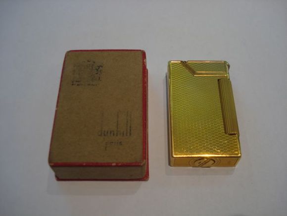 Bonhams : DUNHILL: A 9 carat gold 'Broadboy MK2' lighter, by Alfred ...