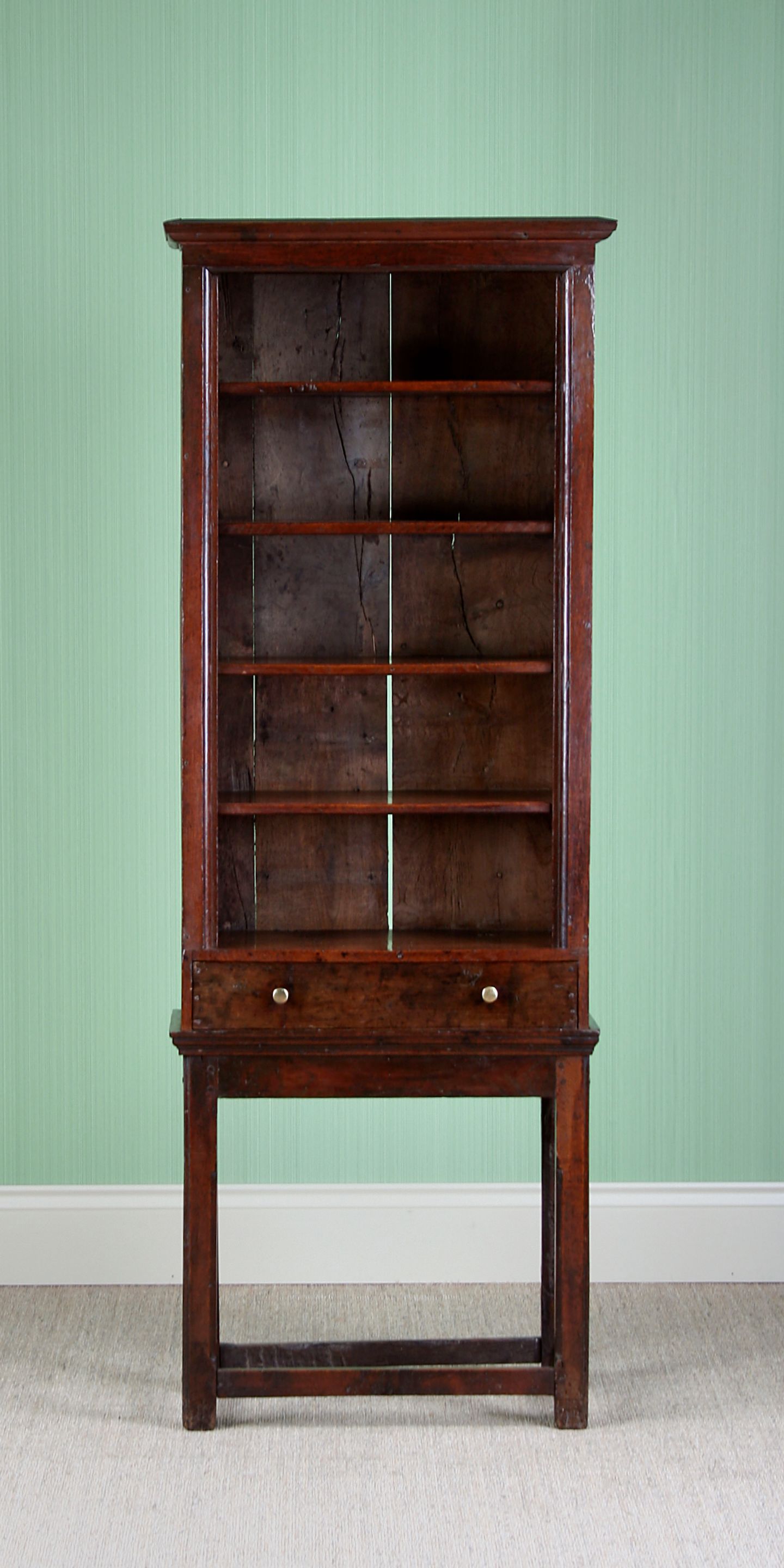 Bonhams : An oak upright open bookcase on stand