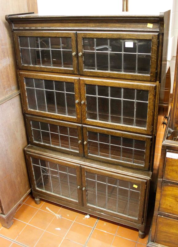 Bonhams : An oak four section bookcase,
