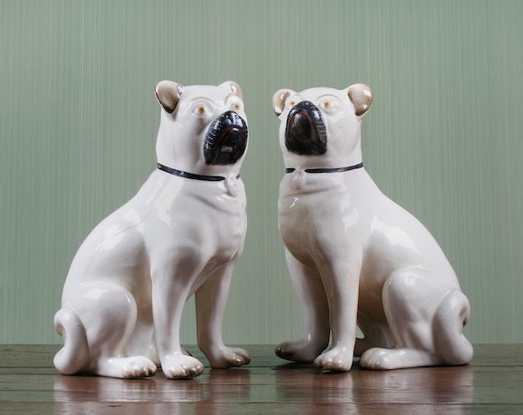Bonhams : A matched pair of Staffordshire pug dogs, circa 1880