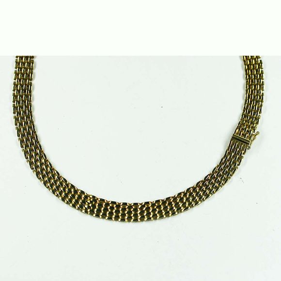 Bonhams : A 9ct gold mesh link collarette.