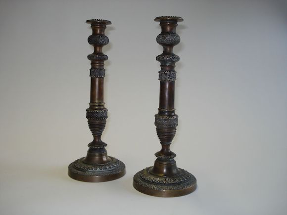 Bonhams : A pair of early 19th Century French bronze candlesticks