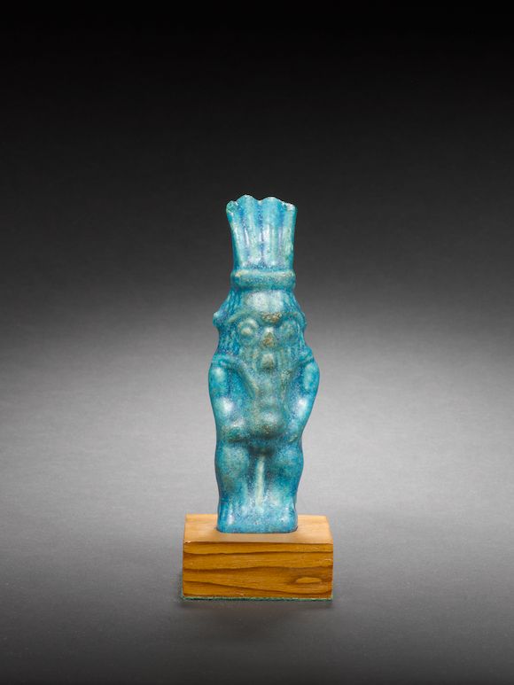 Bonhams : An Egyptian large bright blue glazed composition figure of Bes