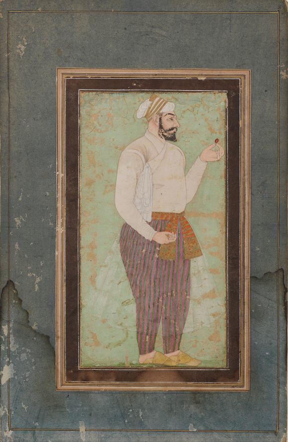 Bonhams : A male courtier holding a spinel Mughal, circa 1680