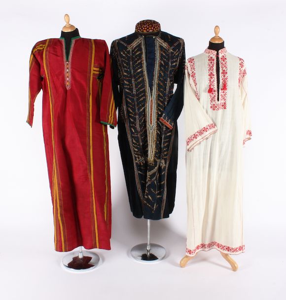 Bonhams : Three Arabic embroidered tunics and a hat