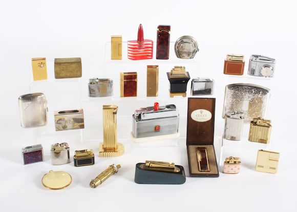 Bonhams : DUNHILL: a gilt metal 'Rollalite' lighter (qty)