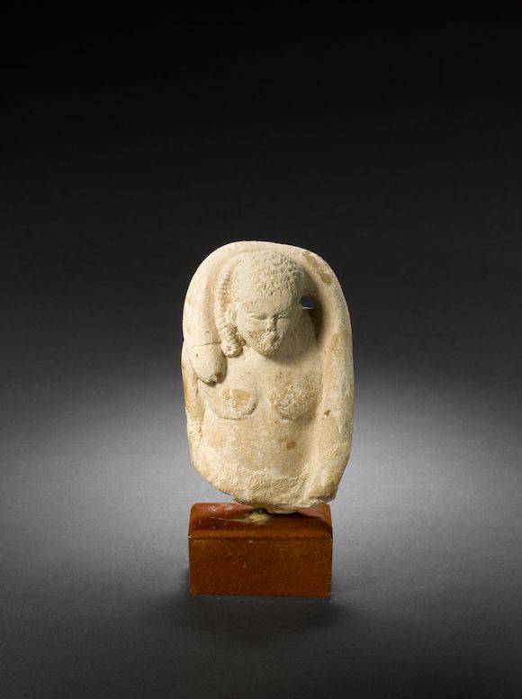 Bonhams : An Egyptian limestone fragment of a phallic figure of Harpokrates