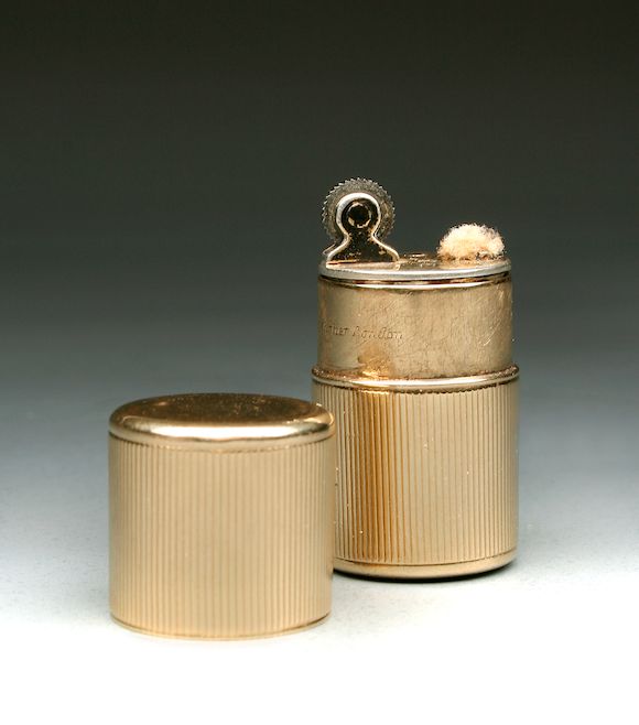 Bonhams : Cartier, London; A 9 carat gold tubular petrol lighter, by J ...