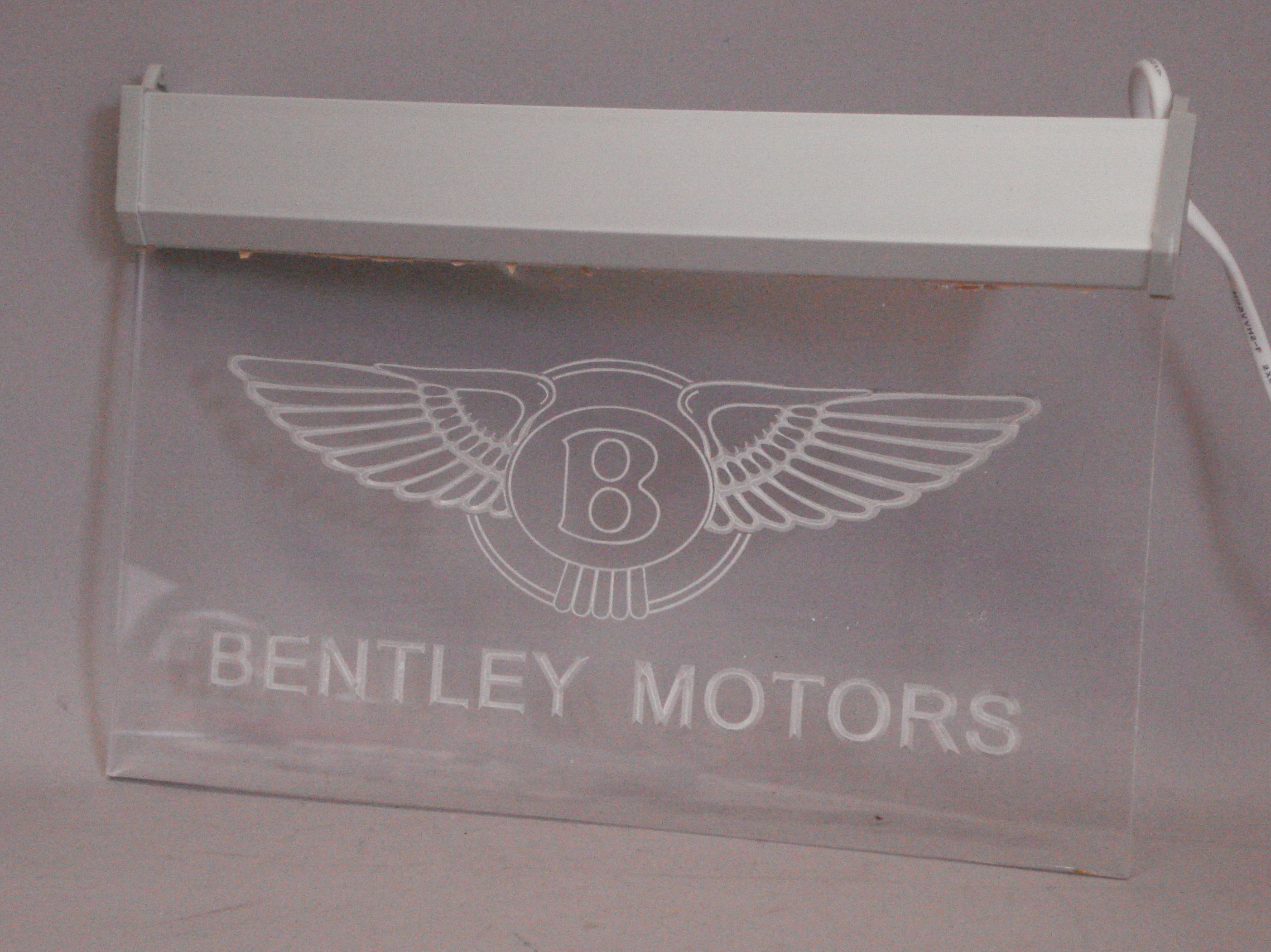 Bonhams Cars : An illuminated Bentley Motors garage hanging sign,