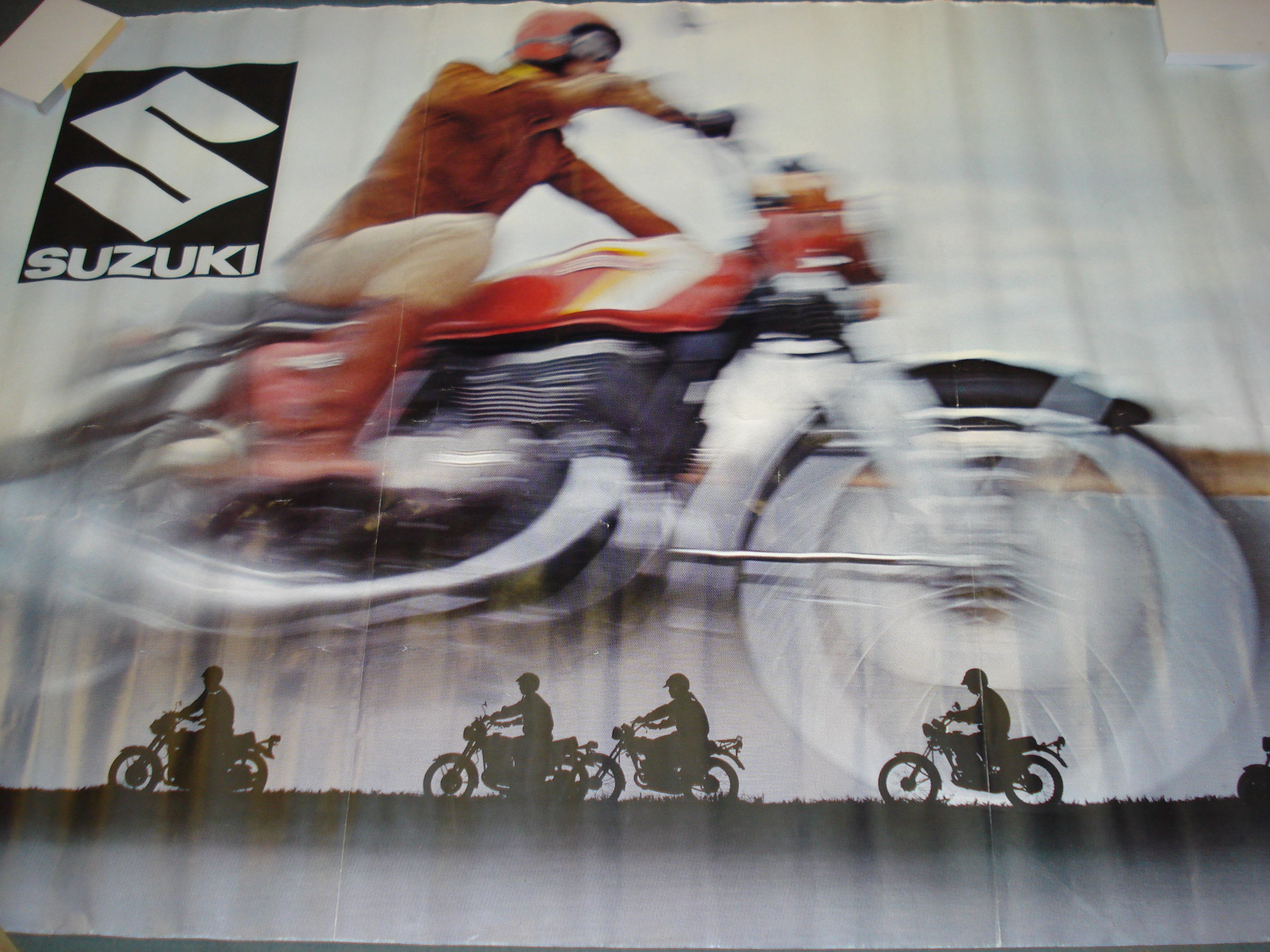 Bonhams Cars : A quantity of Suzuki and Honda showroom advertising posters,