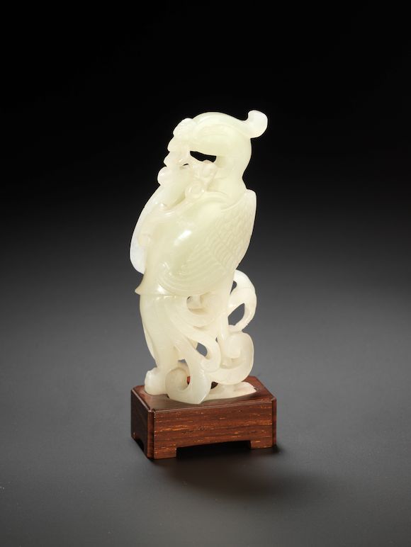Bonhams : A pale green jade carving of a standing phoenix 18th century