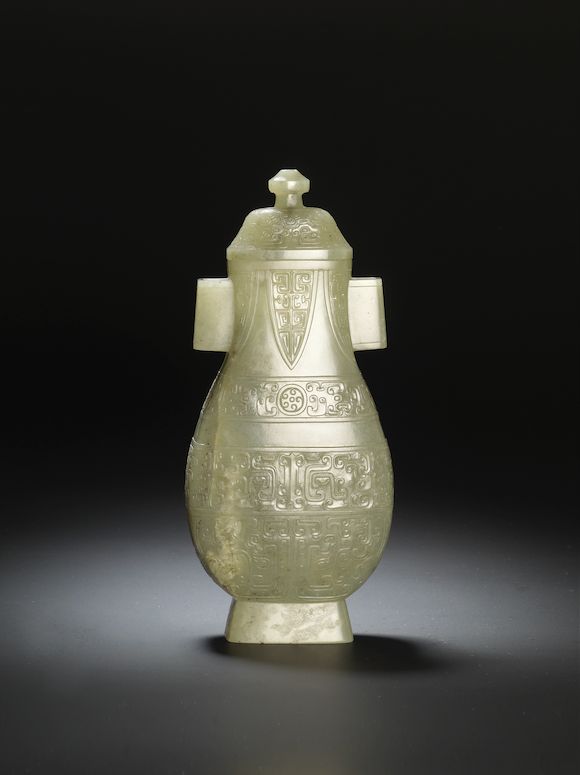 Bonhams : A greenish-grey jade archaistic 'arrow' vase and cover, hu ...