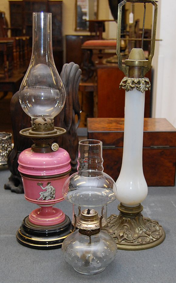 Bonhams : A collection of three early 20th century paraffin lamps