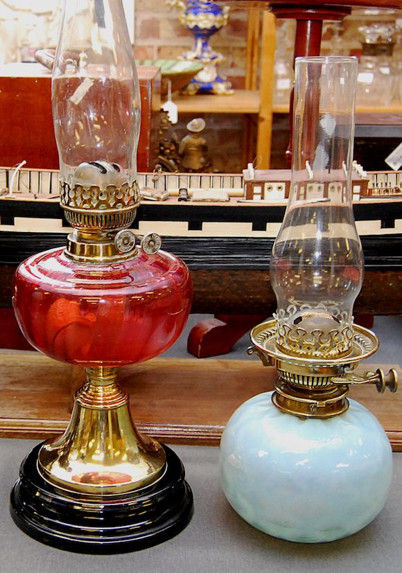 Bonhams : Two oil lamps The first of circular tiered base with knopped ...