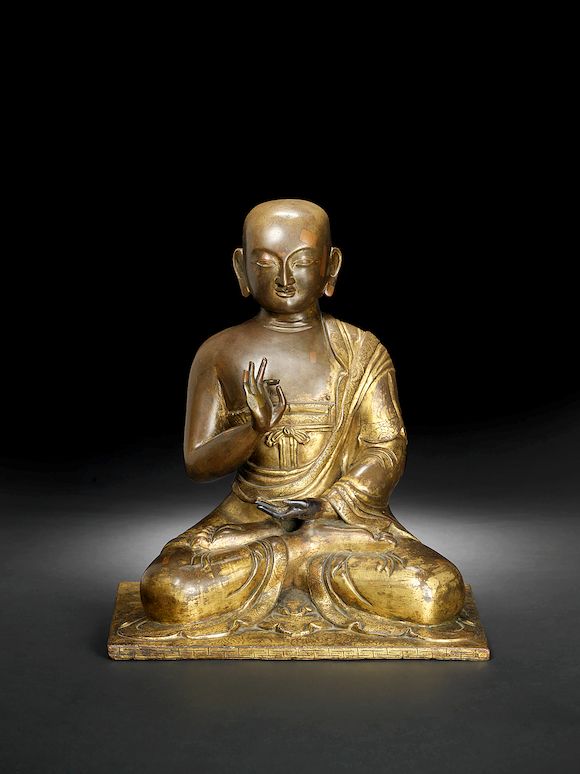 Bonhams : A rare gilt-bronze figure of a luohan Circa 15th century