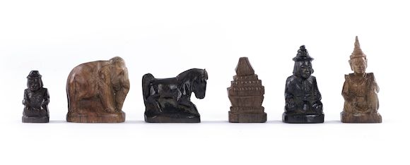 Bonhams : A Burmese wooden figural chess set, 20th century,