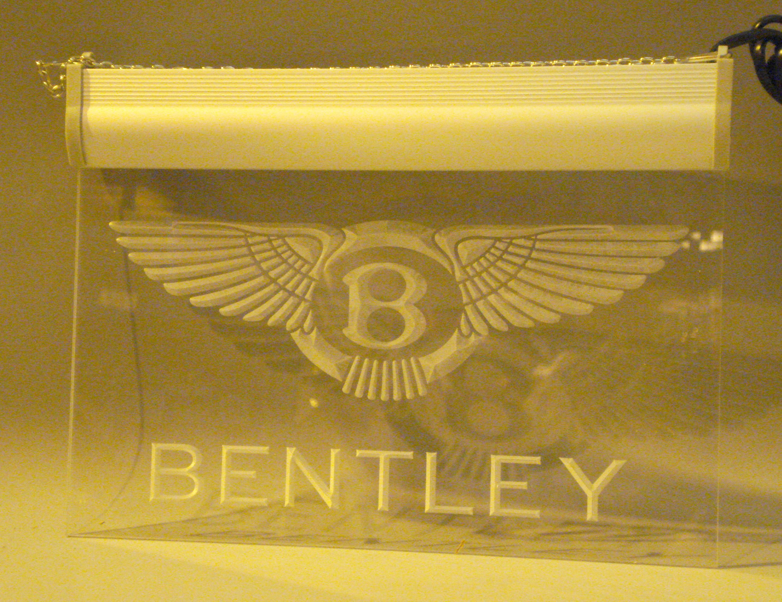 Bonhams Cars : An illuminated Bentley Motors garage hanging sign,
