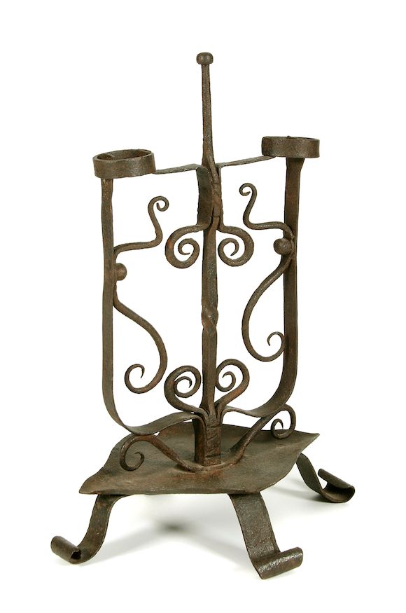 Bonhams : An unusual wrought-iron double rush-light holder or peerman